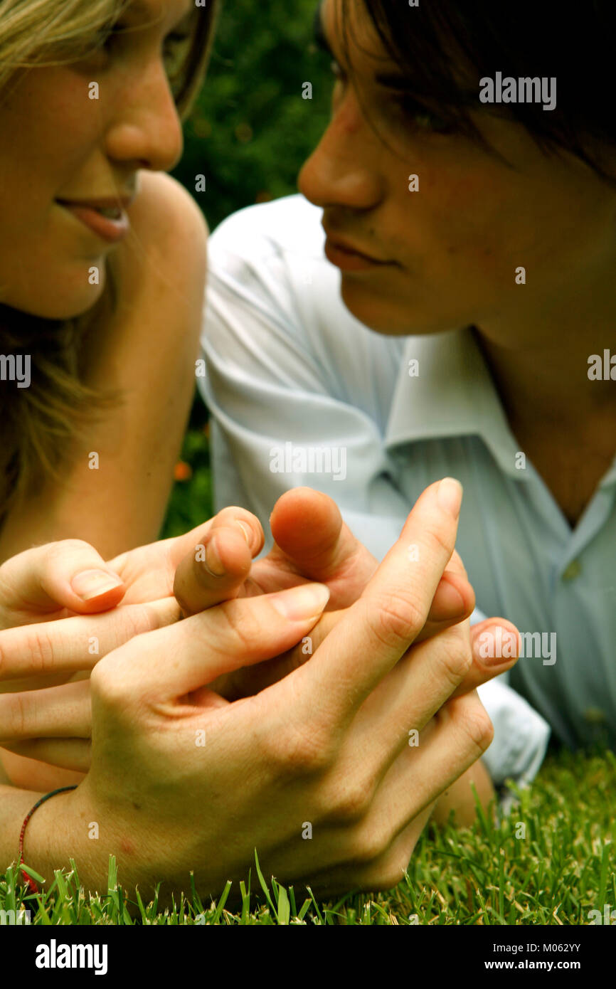 couple touching hands Stock Photo - Alamy
