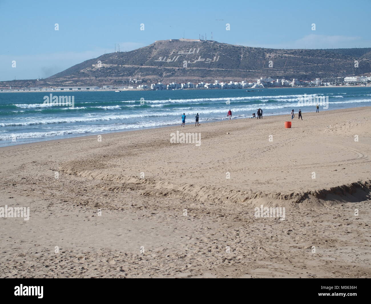 Sandy beach in travel AGADIR city in MOROCCO landscape, clear blue sky ...