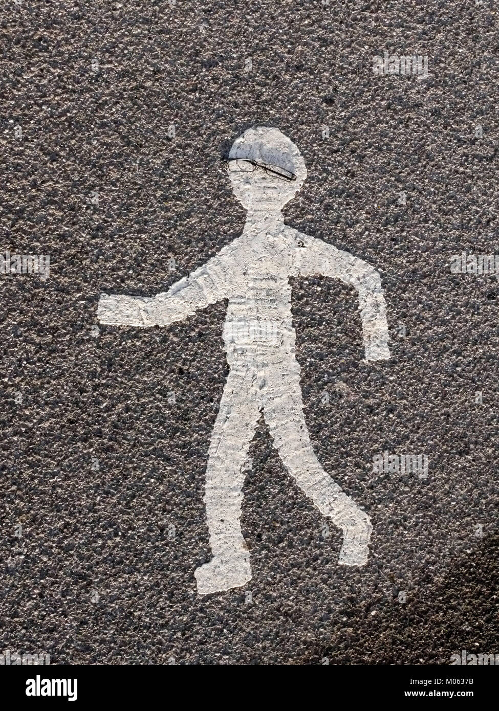Road marking of human figure on pavement in Devon, England, UK Stock ...