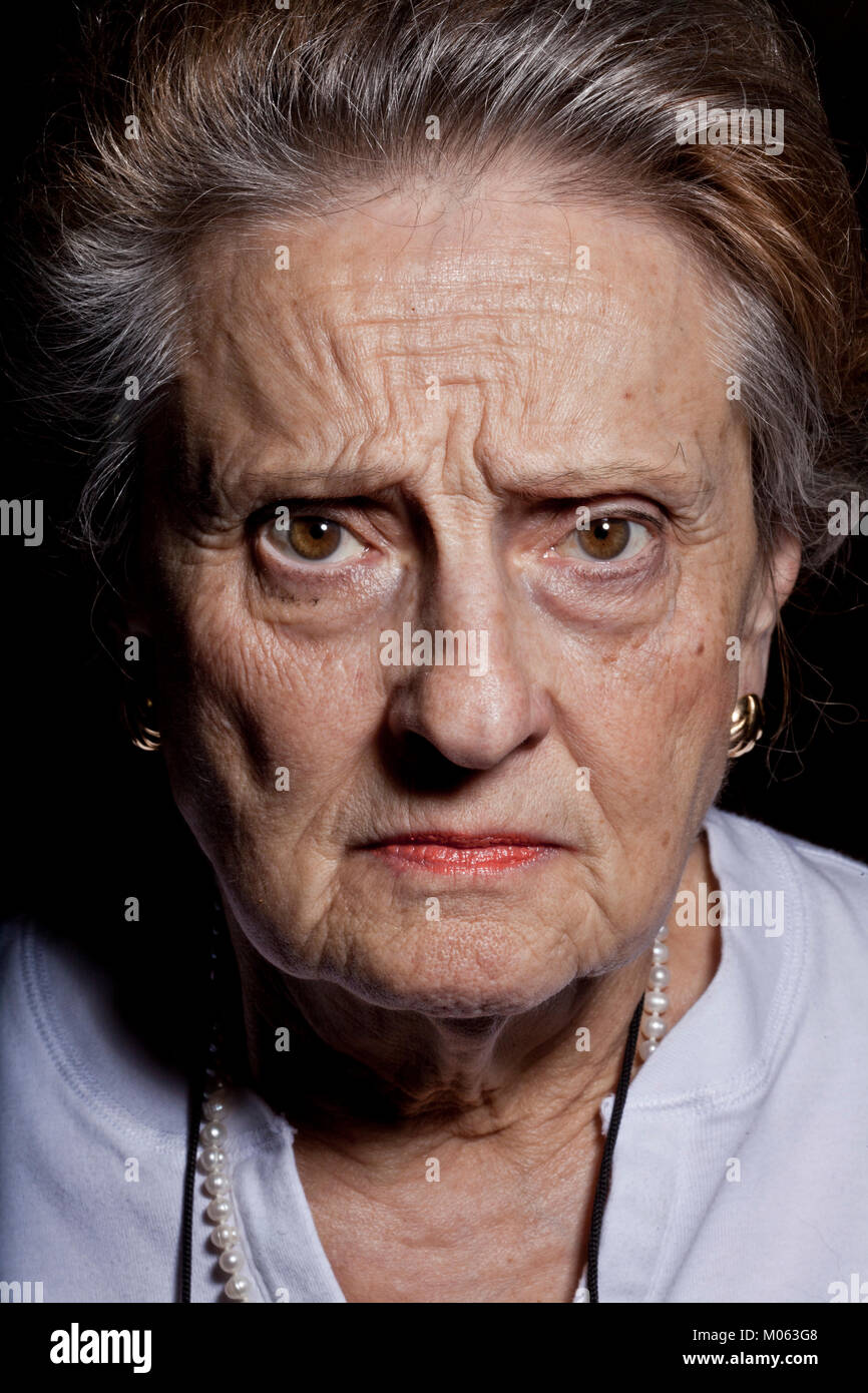 elderly woman with a stern look Stock Photo - Alamy