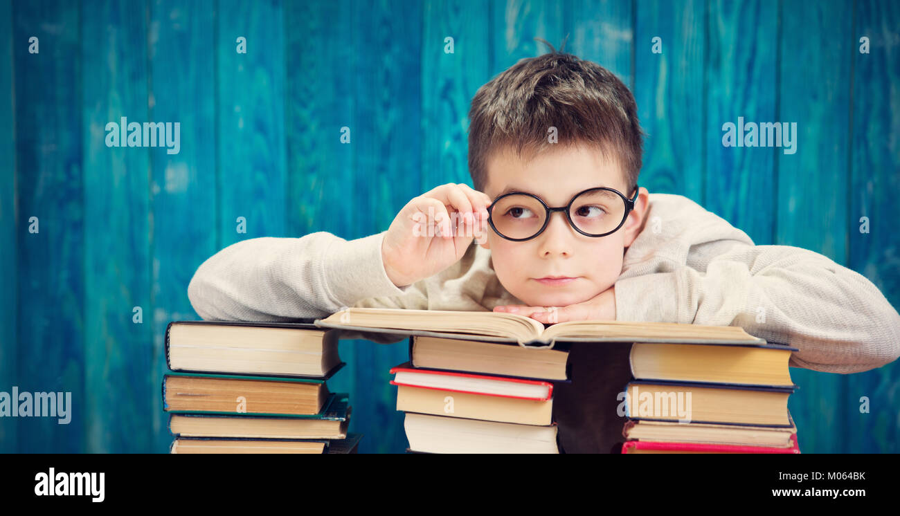 eight years old child reading a book Stock Photo - Alamy