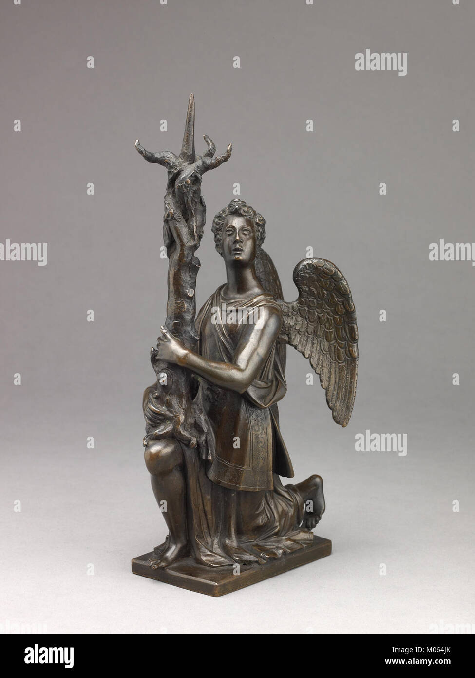 This candlestick, shaped like a kneeling angel, is a historical piece ...