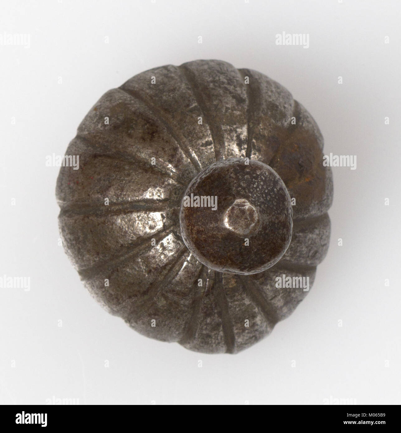 This MET object, labeled 'Boss and Nail', represents an item from the ...