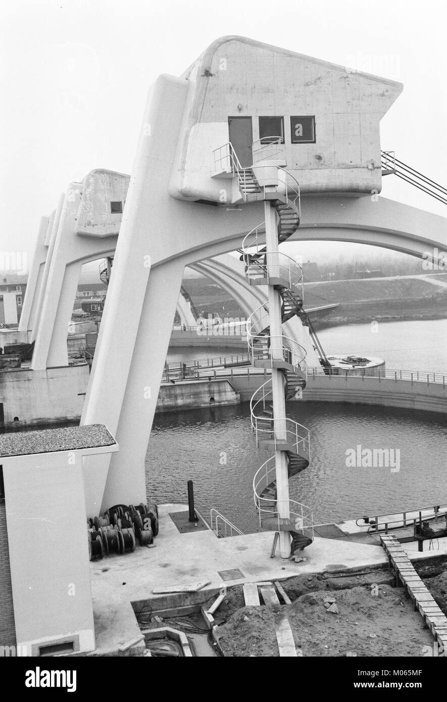 This historic photograph depicts the construction of a dam at Hagestein ...