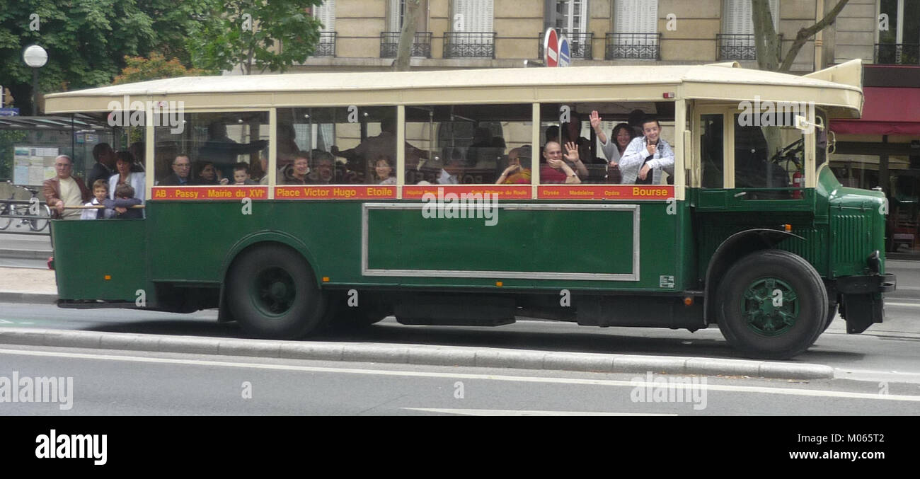 This historical photograph depicts an old bus on Boulevard du ...