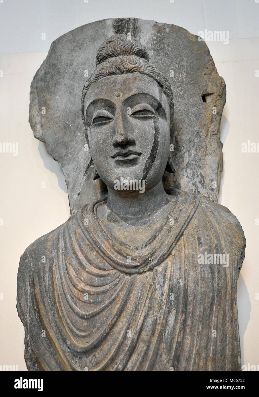 This Gandharan Buddha sculpture, from the 2nd–3rd century CE, reflects ...