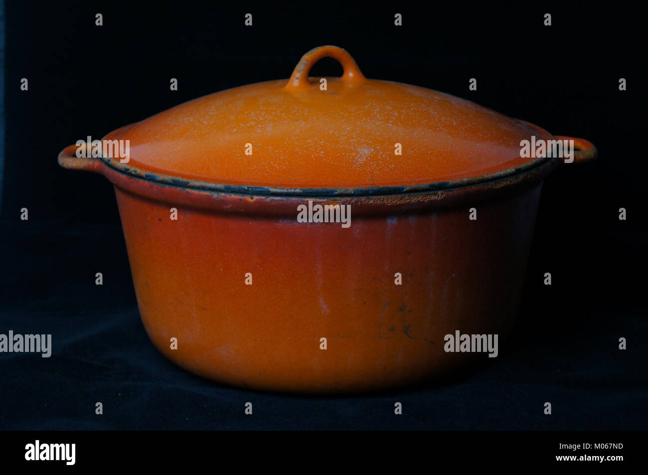 Cadmium orange cast iron pot Stock Photo - Alamy
