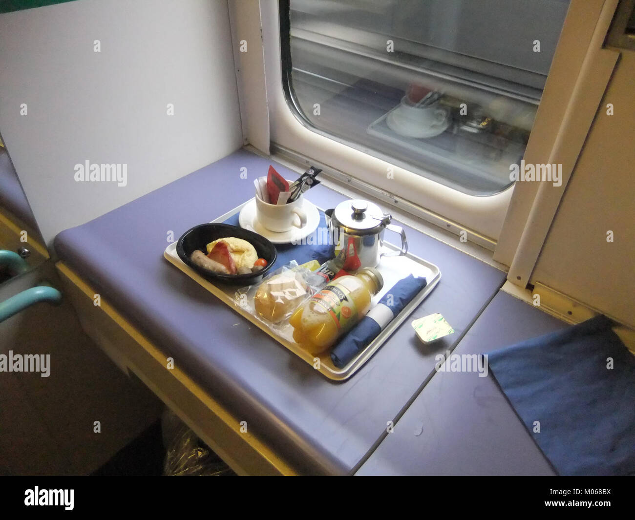 This image depicts the Caledonian Sleeper, a luxury overnight train ...