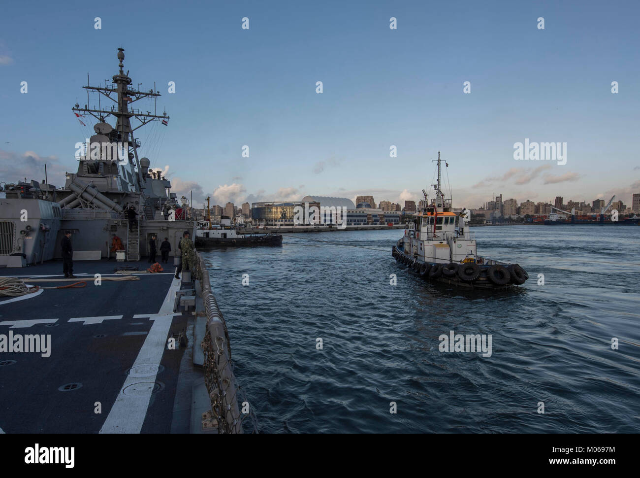 Egyptian tugboats aid the Arleigh Burke-class guided-missile destroyer ... Egyptian tugboats aid the Arleigh Burke-class guided-missile destroyer ...