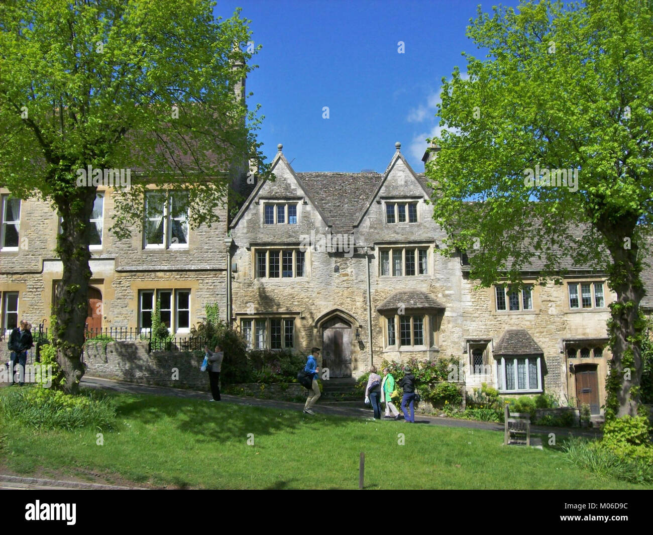 This depiction shows the architecture of Burford High Street, capturing ...
