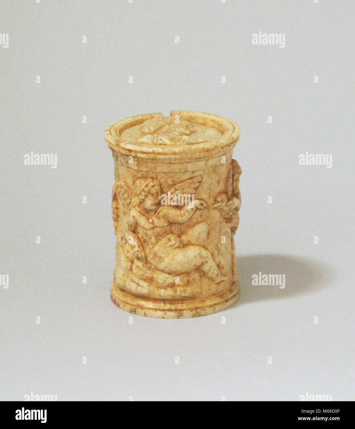 The Ivory pyxis, cataloged as MET SF2316061ab, is an artifact featuring ...