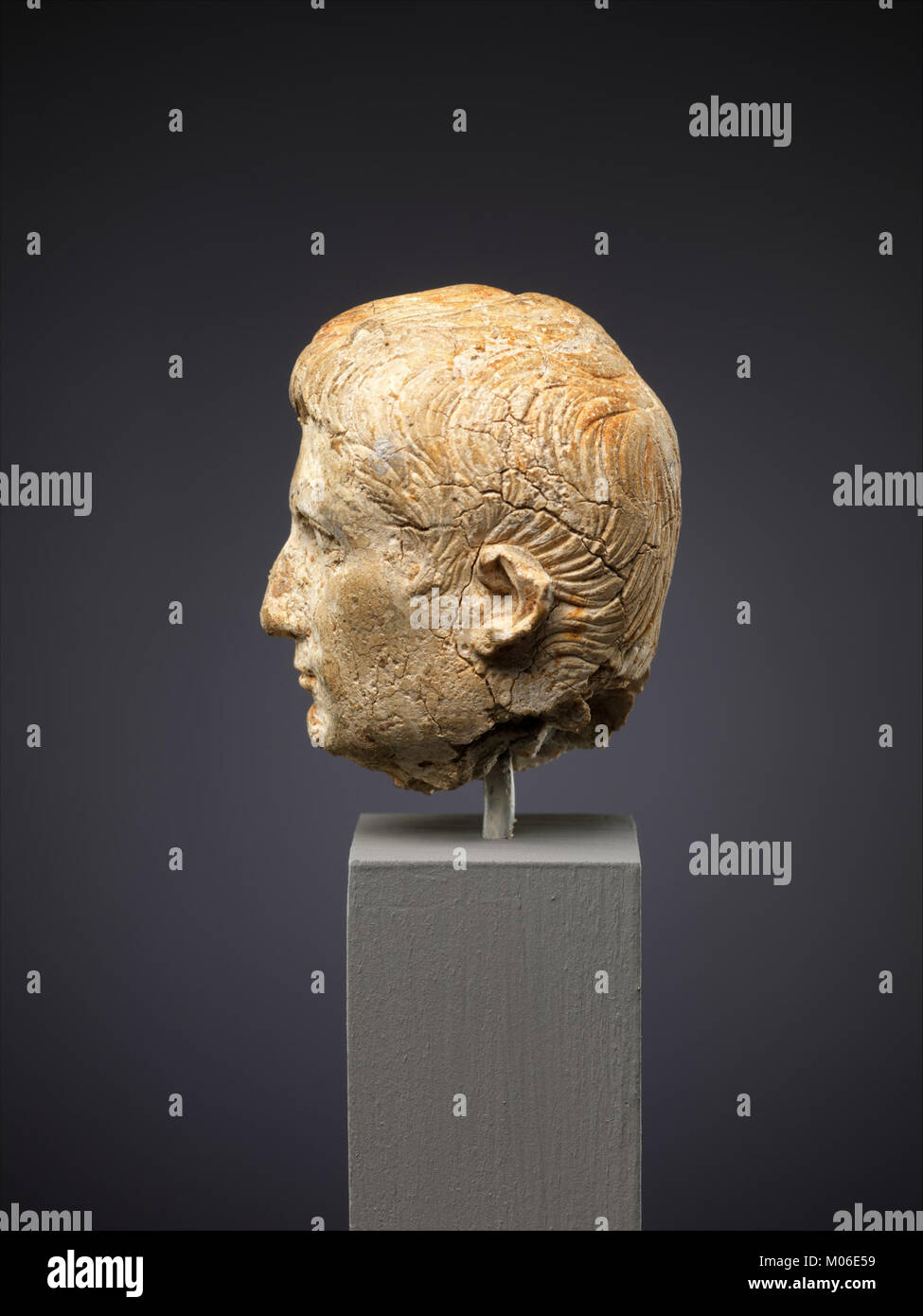 This ivory portrait head represents the emperor Augustus, showcasing ...