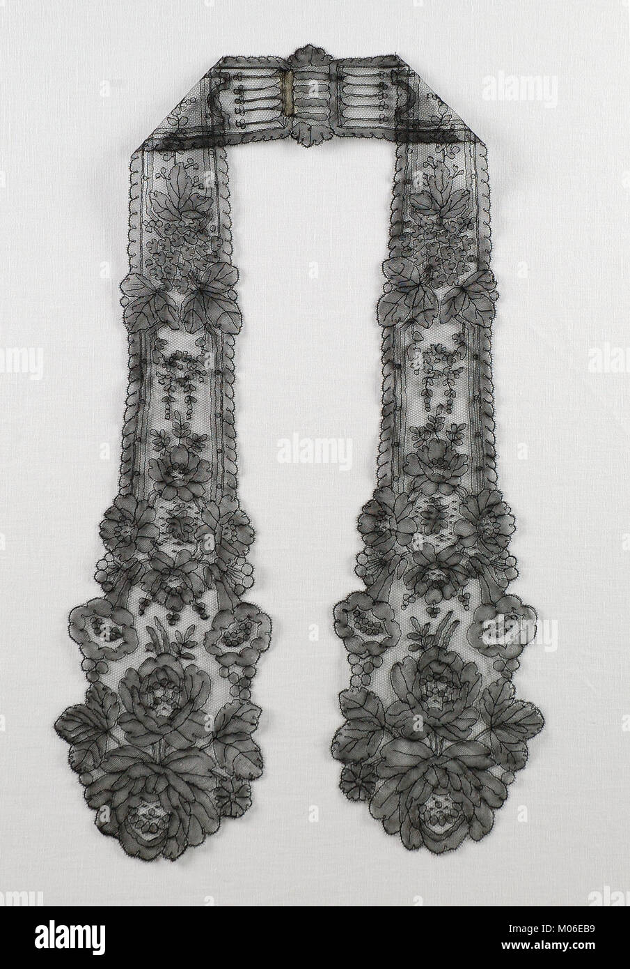 A lappet, a type of decorative headpiece or garment accessory ...
