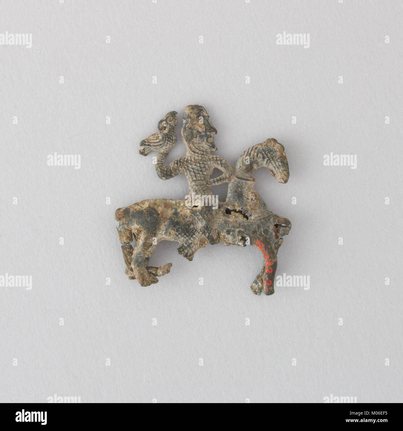 A depiction of a man riding horseback, holding a falcon. This artwork ...