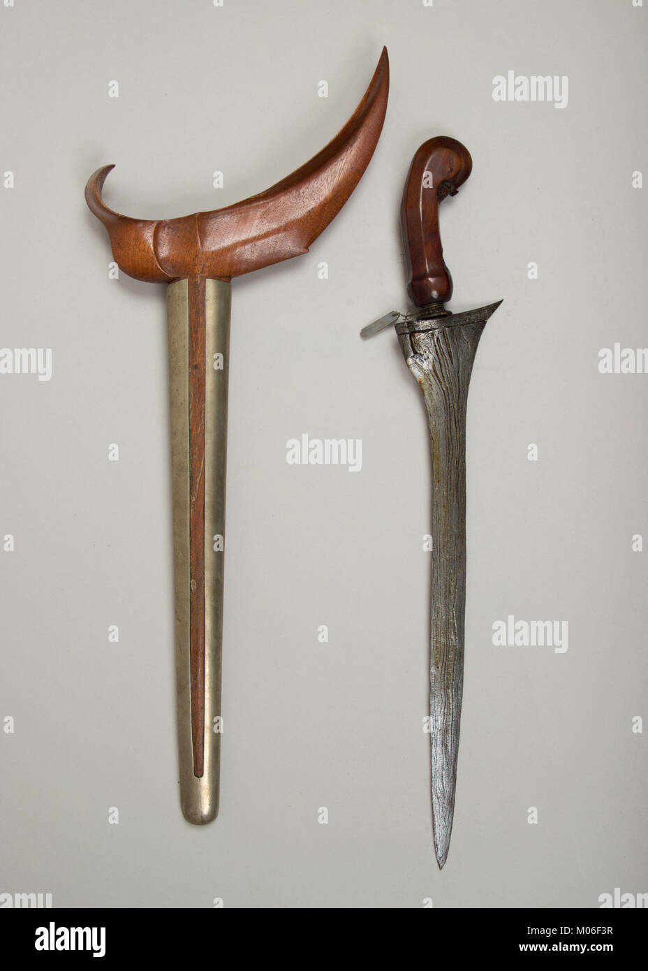 This Kris, a traditional Southeast Asian dagger, is accompanied by a ...