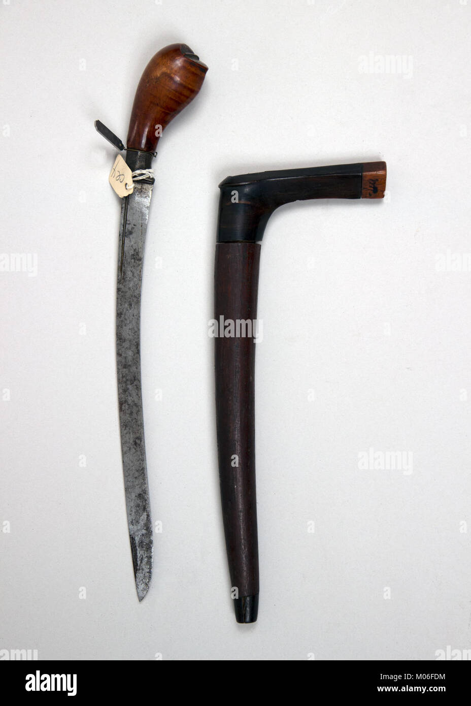 This knife, known as a Bade-bade, is accompanied by a sheath. It ...