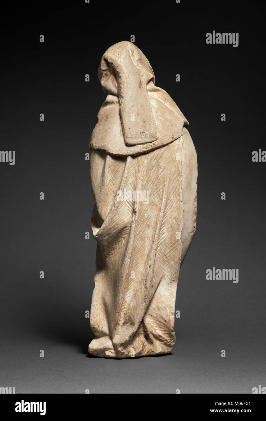 This sculpture represents a mourner, capturing the emotional expression ...