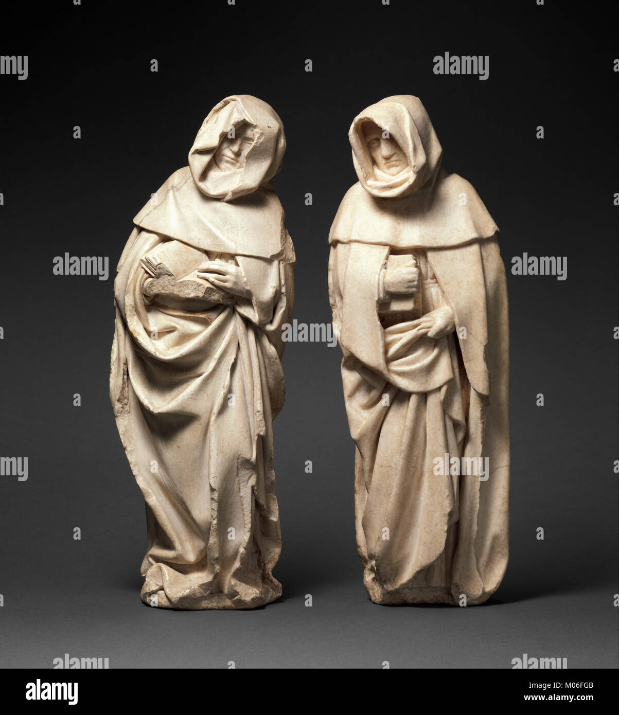 This sculpture of a mourner depicts a solemn figure, possibly from a ...