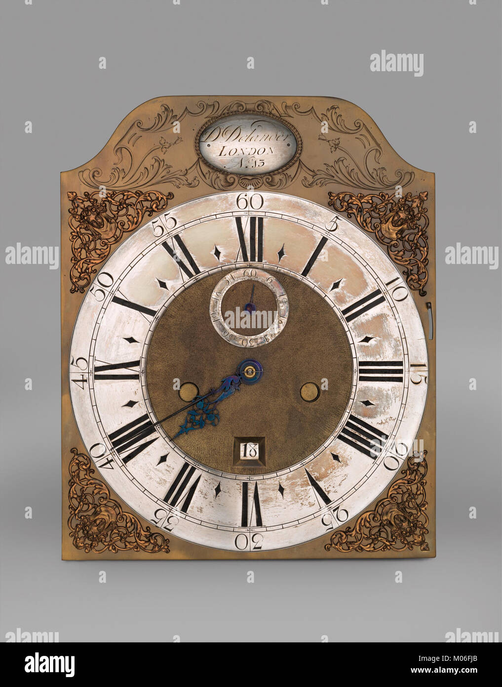 This longcase clock, with an integrated calendar feature, is a fine ...