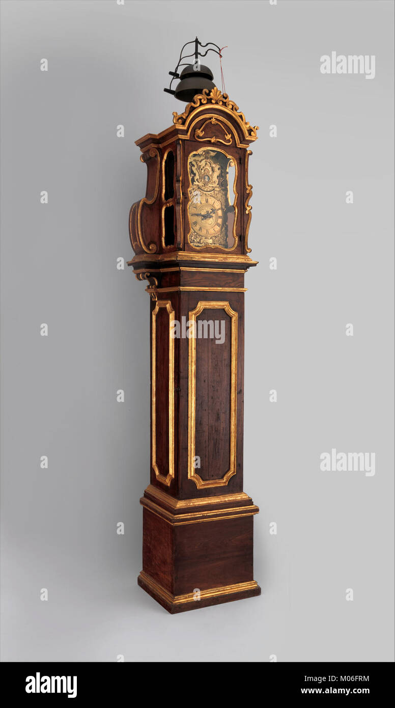 This longcase clock, a type of grandfather clock, features a tall ...