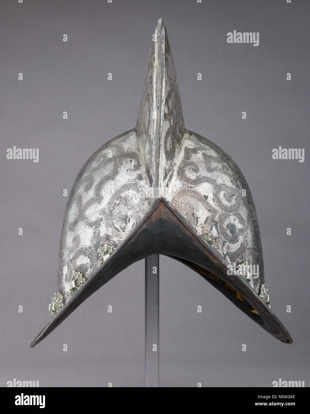 The 16th-century Morion helmet has a distinctive crest and detailed ...