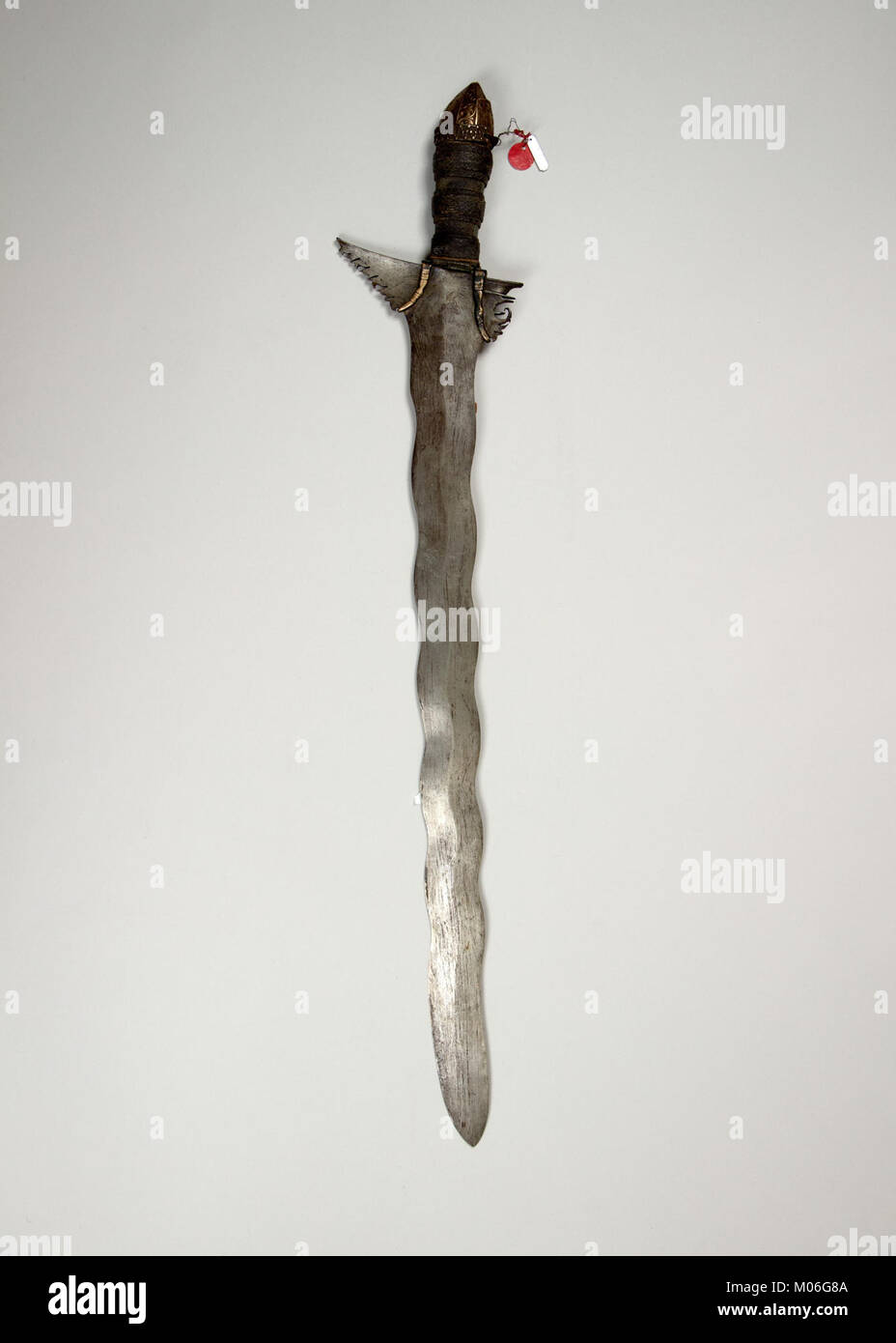 This Kris dagger from Southeast Asia features a wavy blade ...