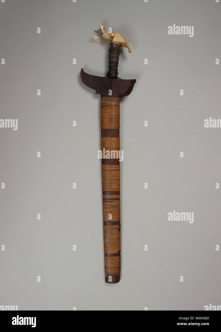 This Kris dagger, featuring a distinctive wavy blade and decorated ...