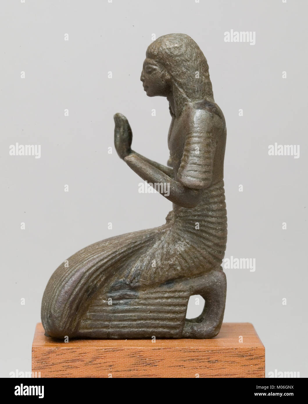 The 'Kneeling Official' is a sculpture depicting a figure in a kneeling ...