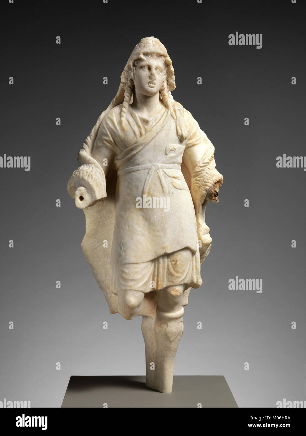 This marble statuette depicts Dionysos, the Greek god of wine, revelry ...