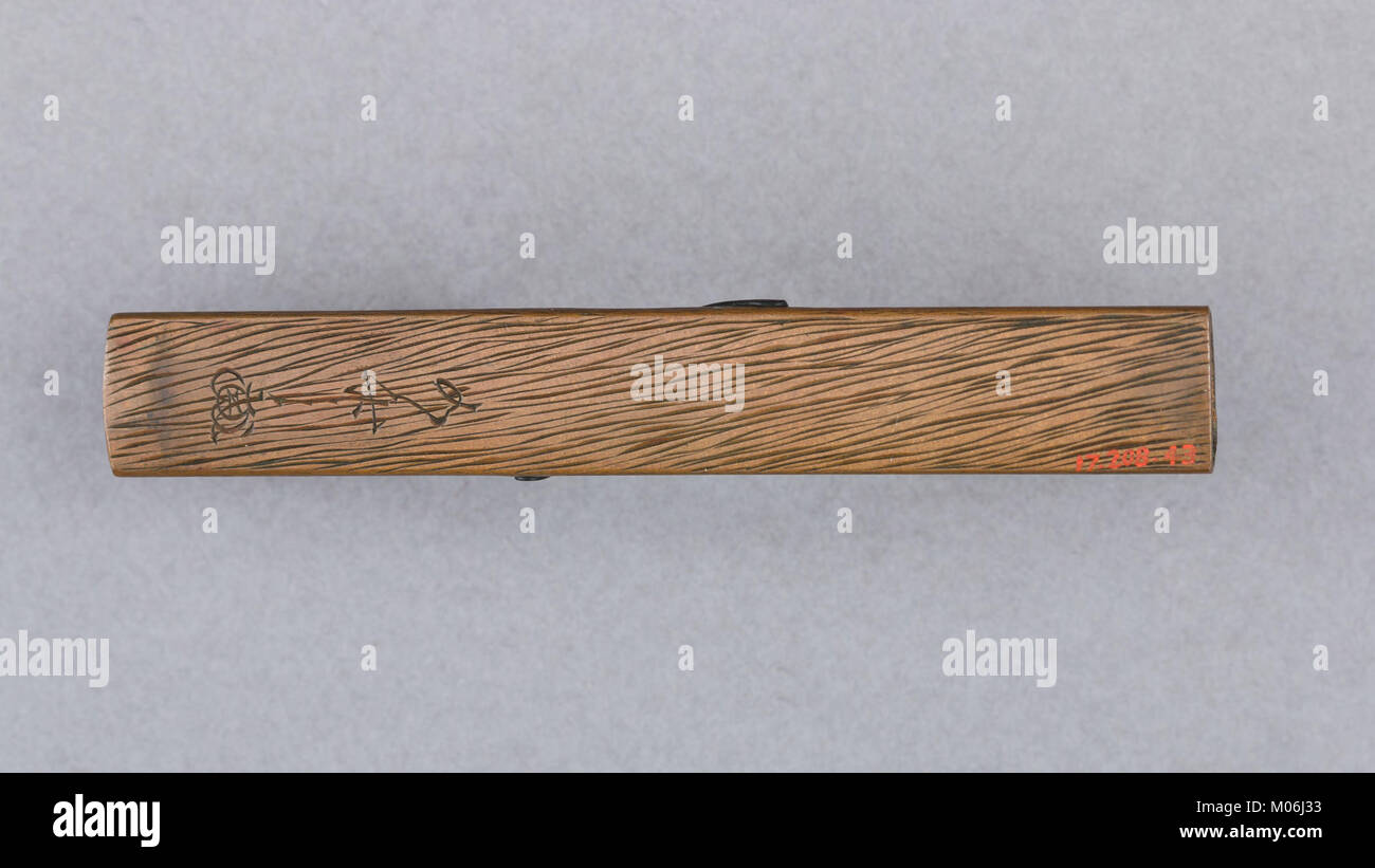 This knife handle, known as a Kozuka, is a Japanese functional art ...