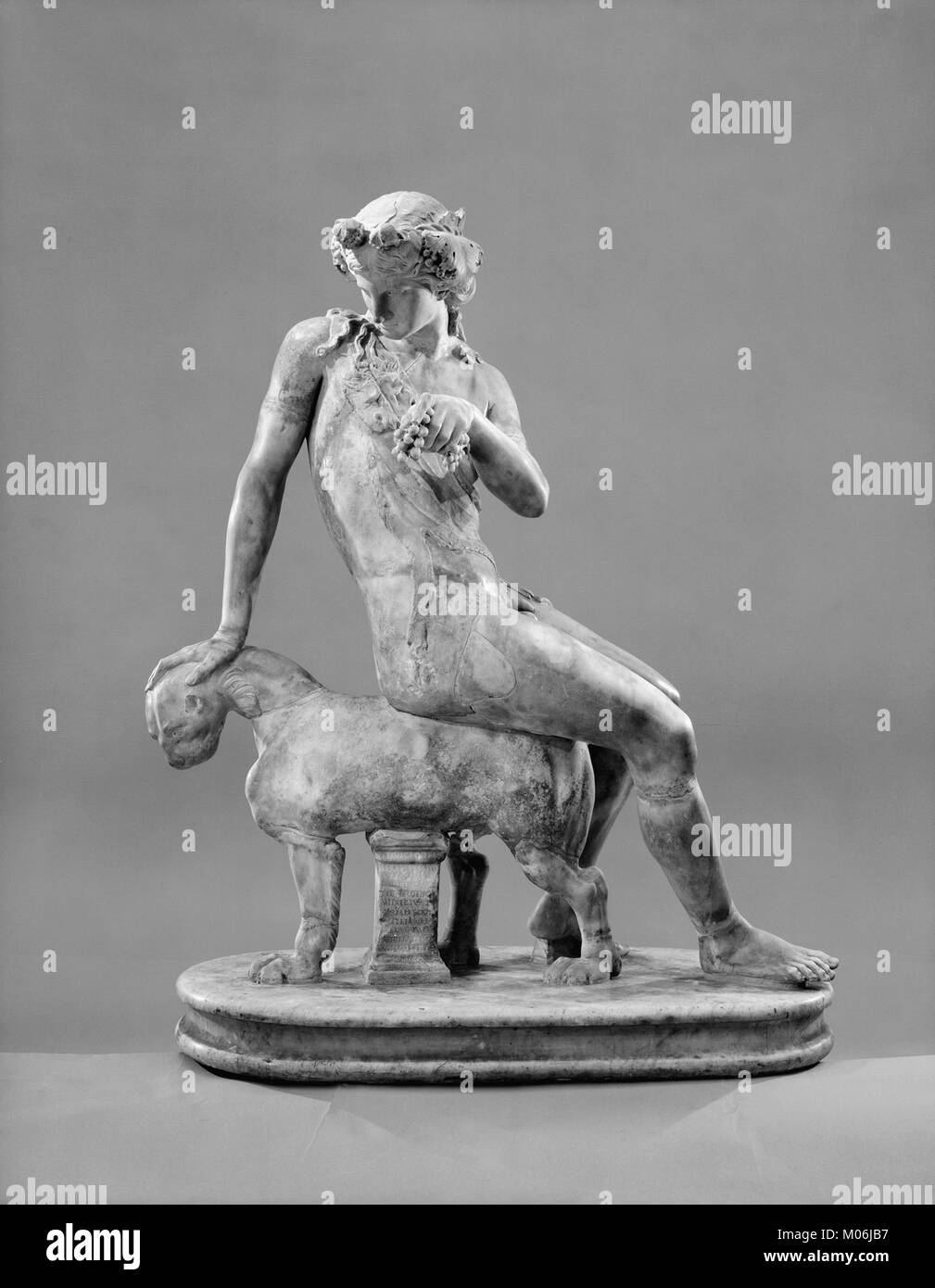 This marble statue depicts the god Dionysos seated on a panther ...