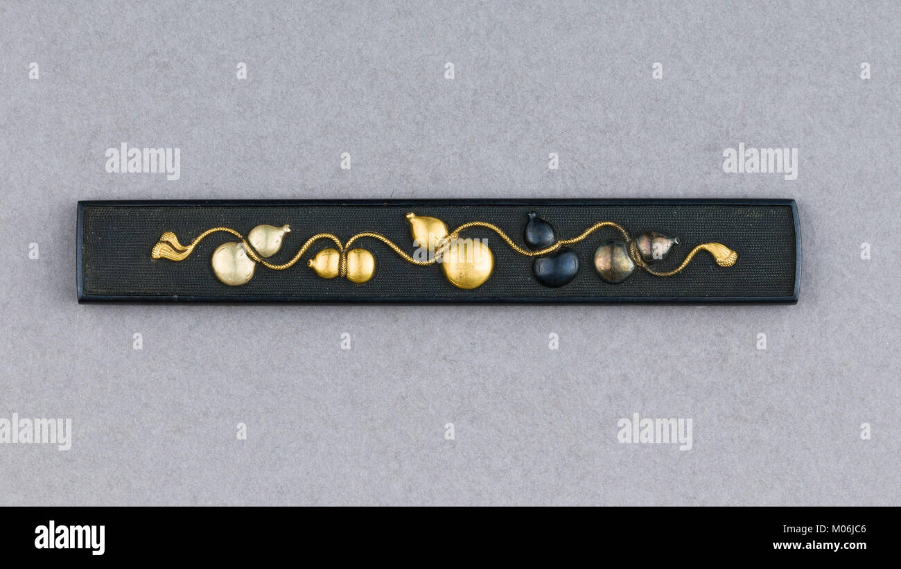 This kozuka knife handle, crafted from intricate materials, was ...