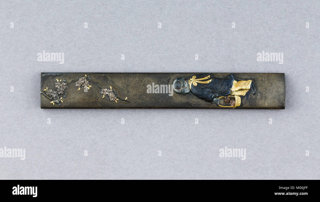 A Kozuka is a traditional Japanese knife handle attached to the hilt of ...