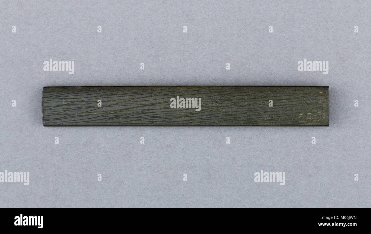 This Kozuka, a knife handle from Japan, showcases intricate ...