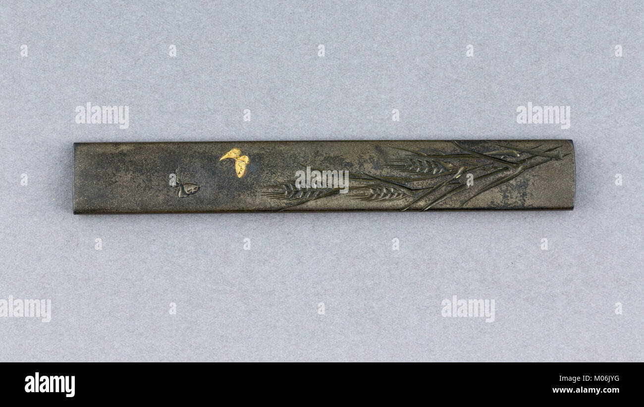 This knife handle, known as a Kozuka, is a traditional Japanese ...