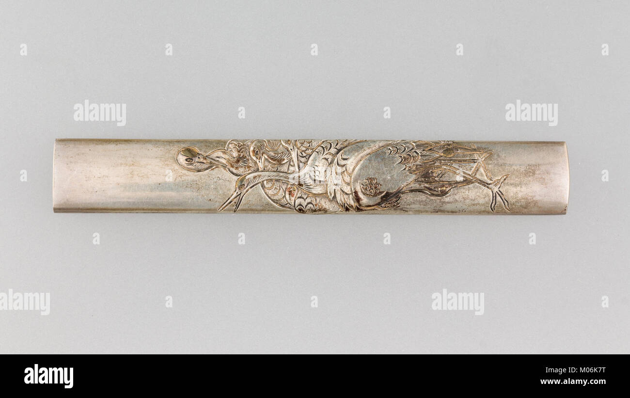 This Kozuka knife handle is a Japanese metal accessory for tsuba (sword ...