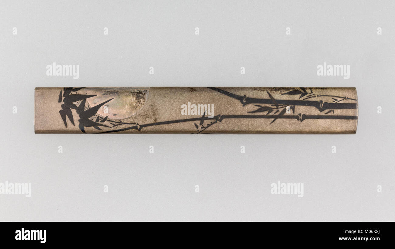 A Kozuka knife handle, part of a traditional Japanese sword. The handle ...