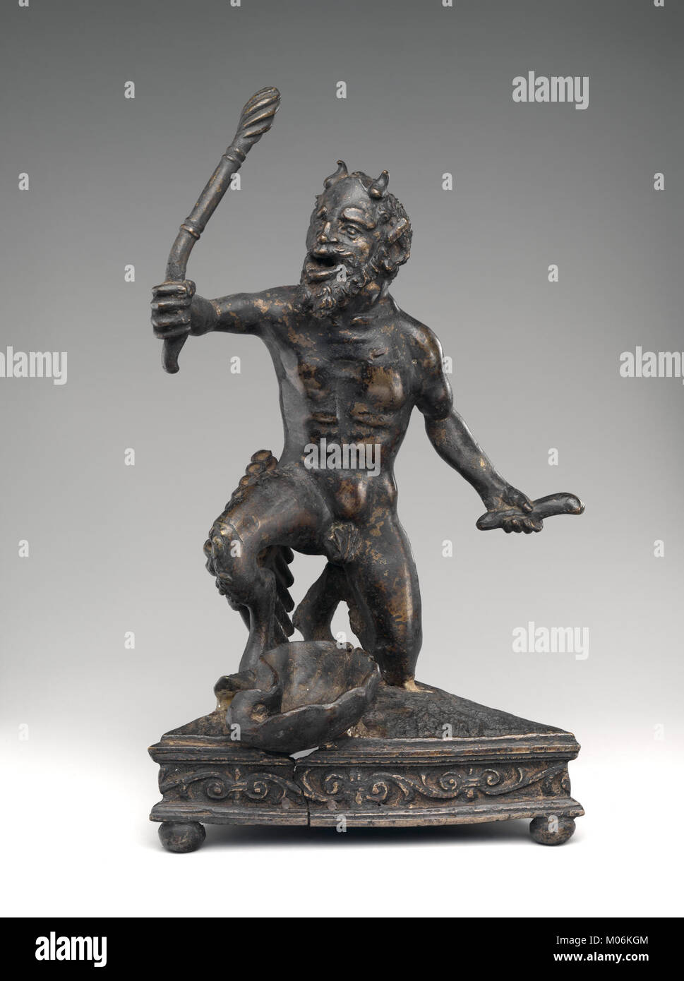 This sculpture depicts a satyr in a kneeling position, reflecting the ...