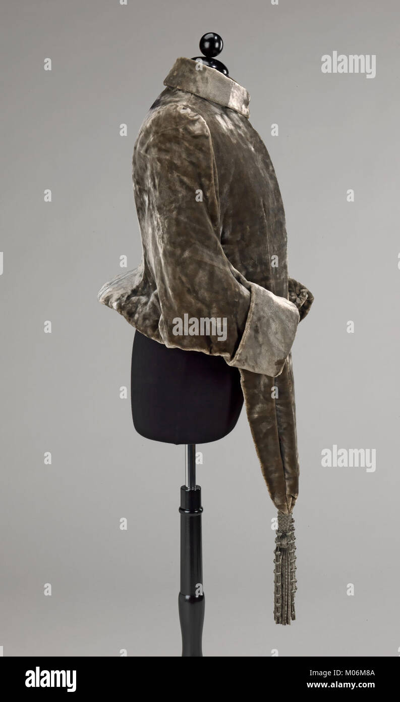 This mantle, part of a historical garment collection, represents the ...