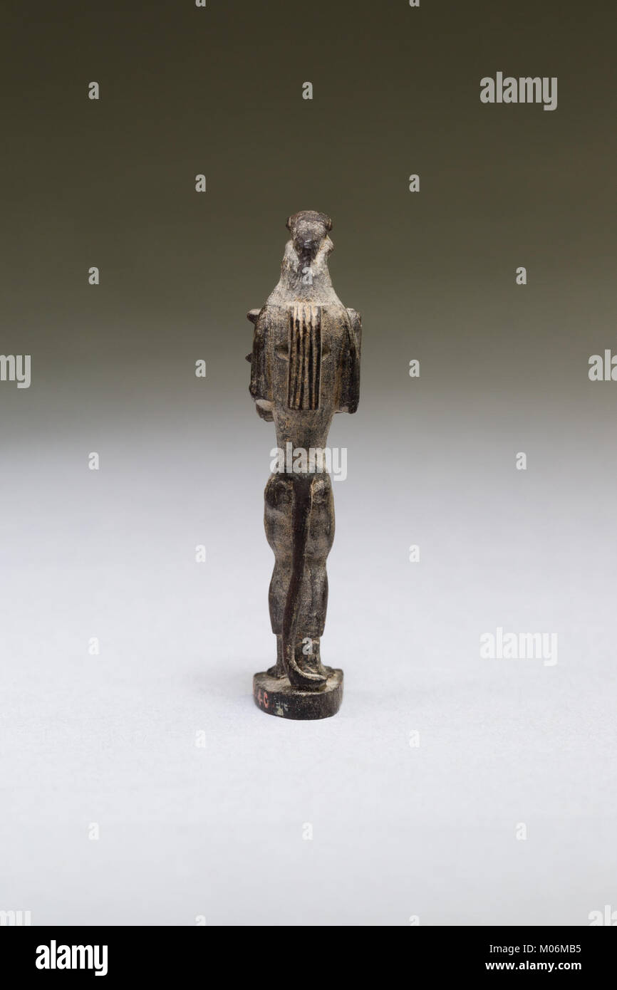 This artifact depicts Nehebkau, the snake deity, holding the wedjat eye ...