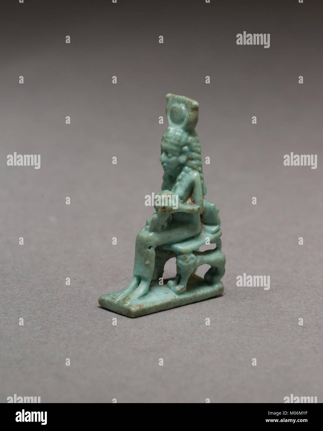 Isis is shown nursing Horus on a throne with lions, illustrating ...