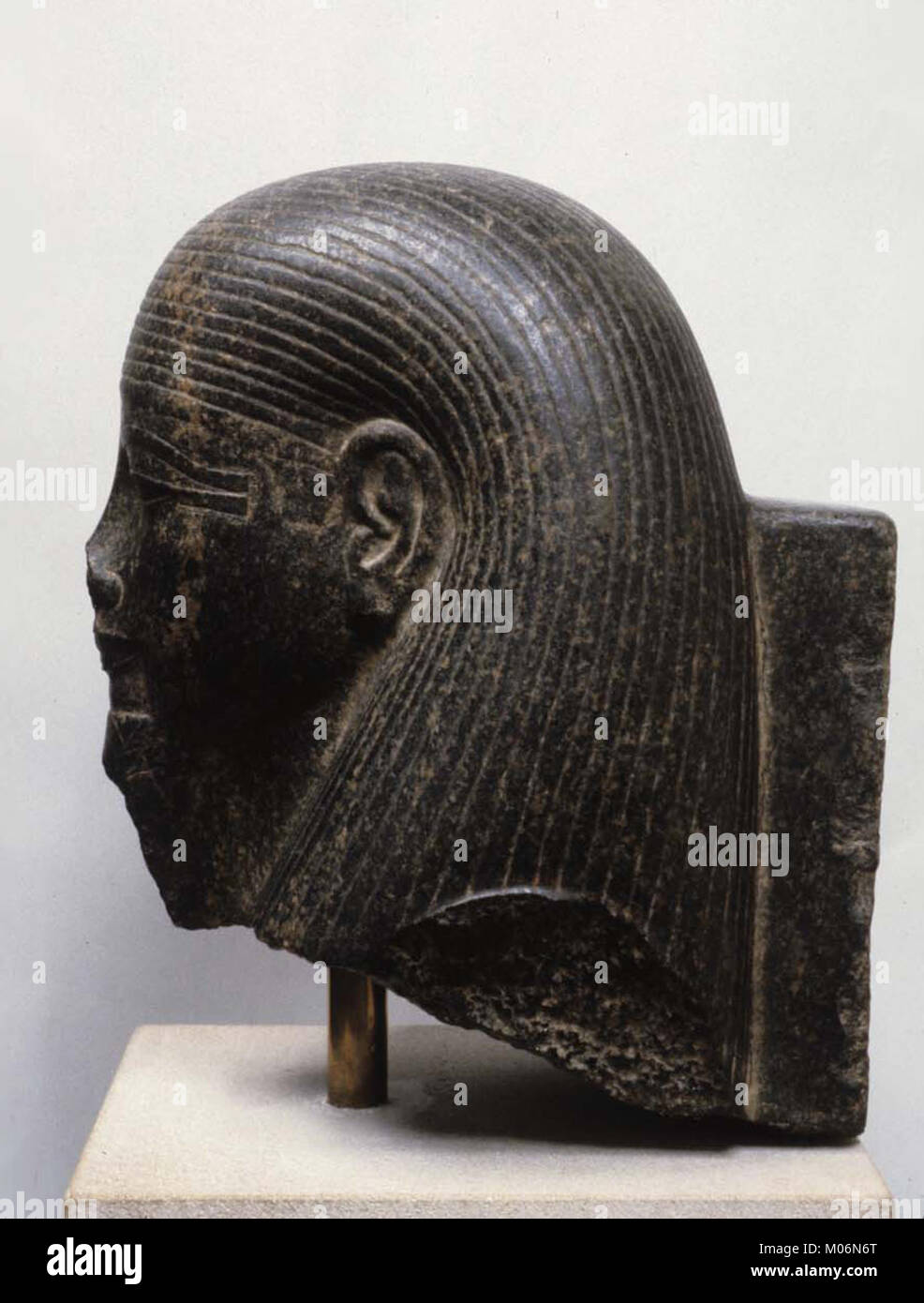 This sculpture depicts a male god, representing ancient religious art ...