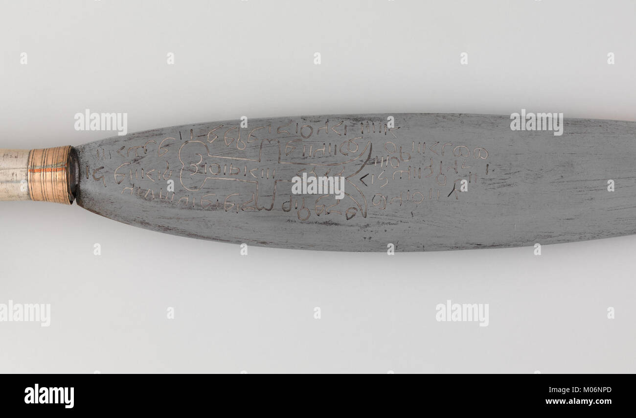 This Barong knife, accompanied by its sheath, is a traditional blade ...