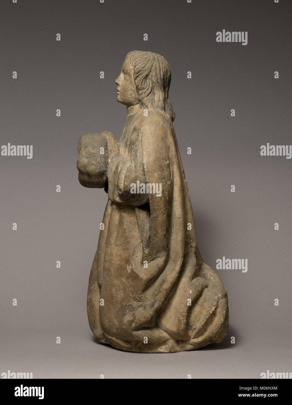 This kneeling donor figure represents a typical offering figure from ...