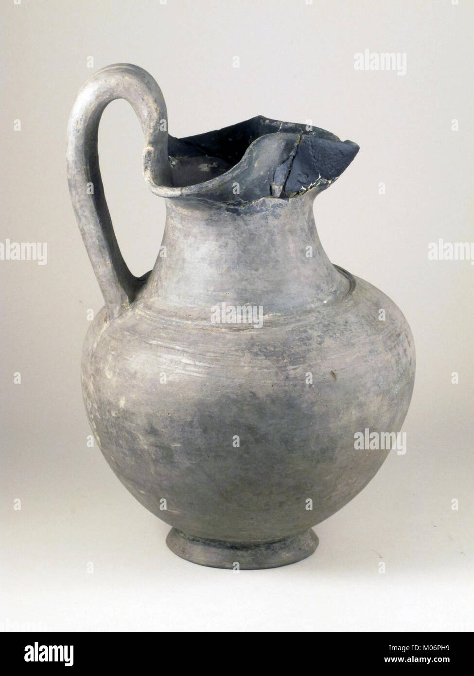 This ancient jug showcases fine craftsmanship and traditional design ...