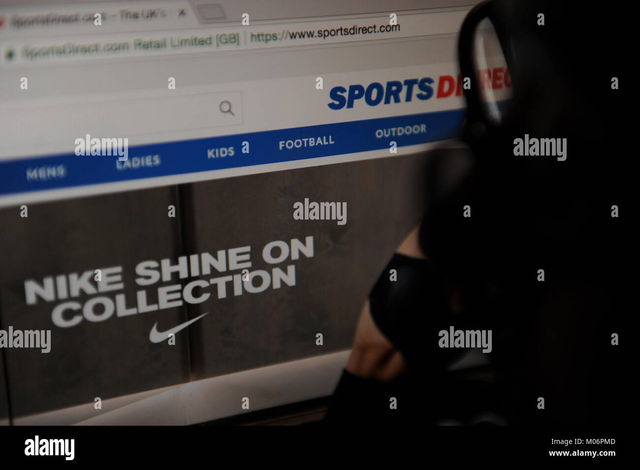 A woman looks on the Sports Direct website Stock Photo - Alamy