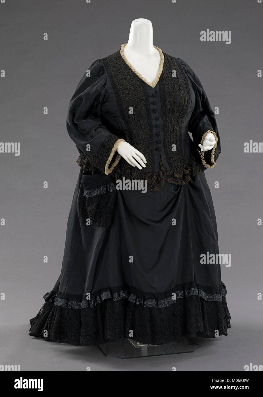 This mourning dress is a somber garment from the 19th century ...