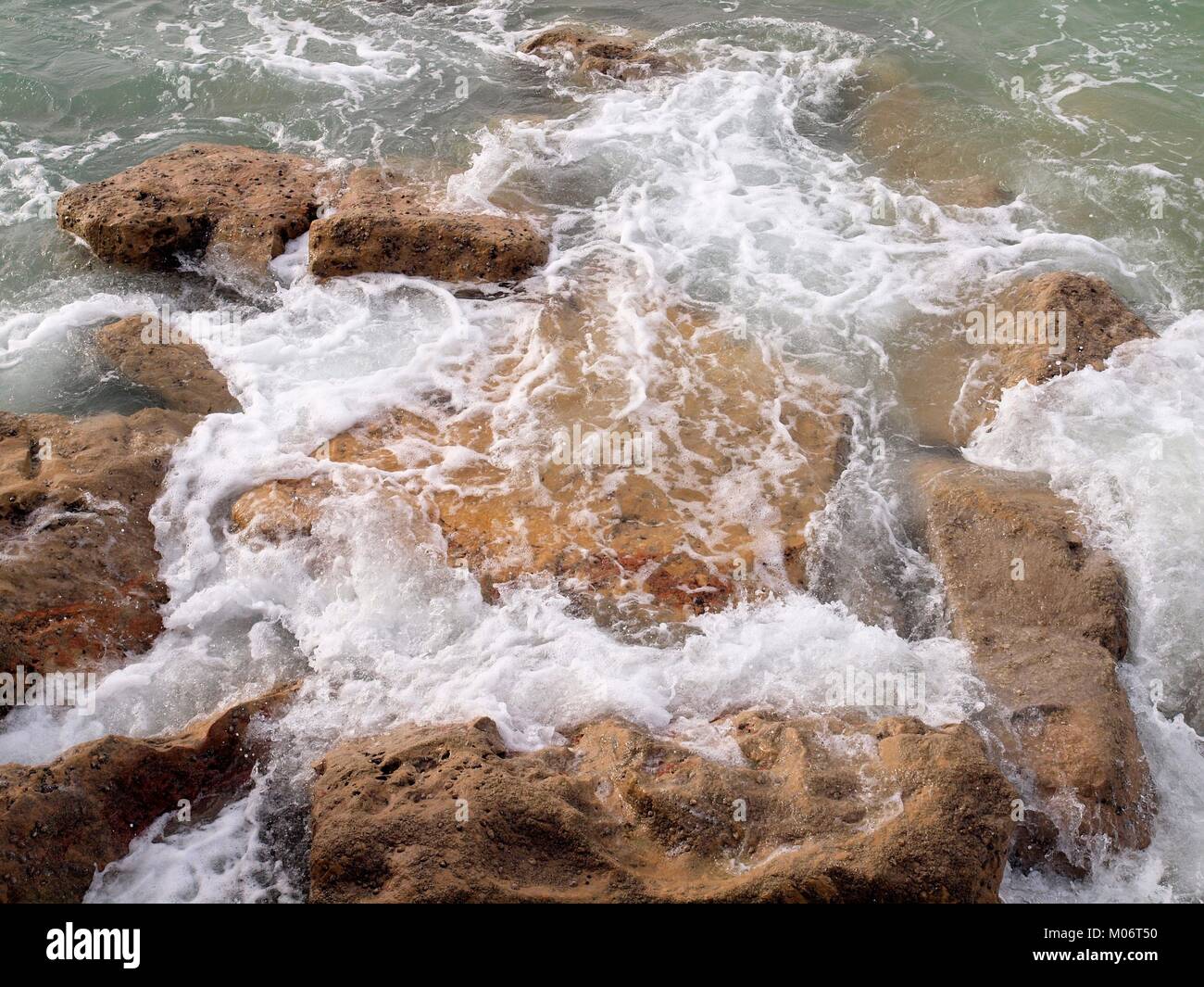 Rocks in the ocean with waves Stock Photo - Alamy