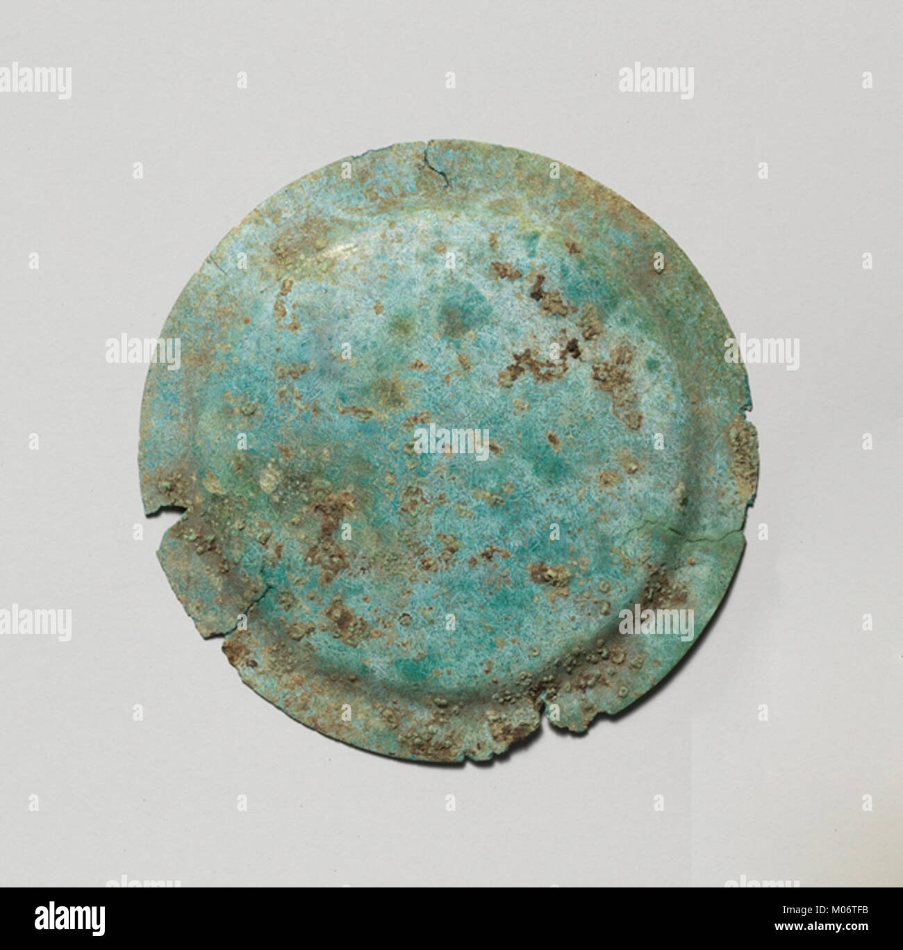 A miniature bronze shield, featuring intricate craftsmanship and design ...