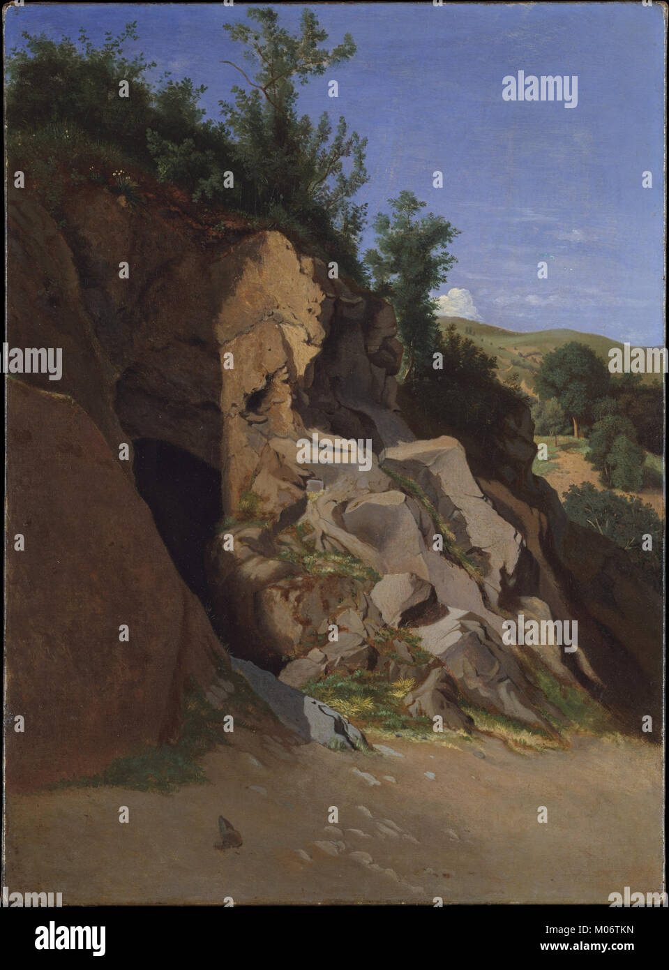 This landscape features a cave setting, emphasizing natural forms and ...